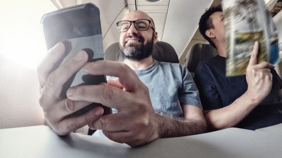 Complete Guide to Using a Cell Phone on a Plane - Nomad Veronica