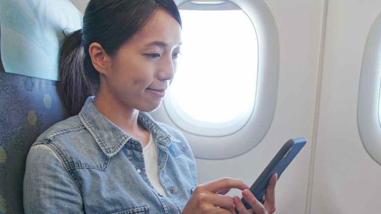 Complete Guide to Using a Cell Phone on a Plane - Nomad Veronica