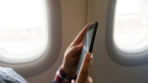 Complete Guide to Using a Cell Phone on a Plane - Nomad Veronica
